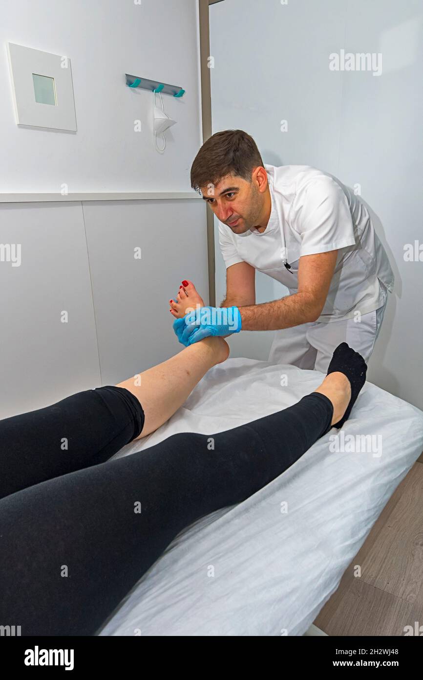 Doctor examining foot hi-res stock photography and images - Alamy