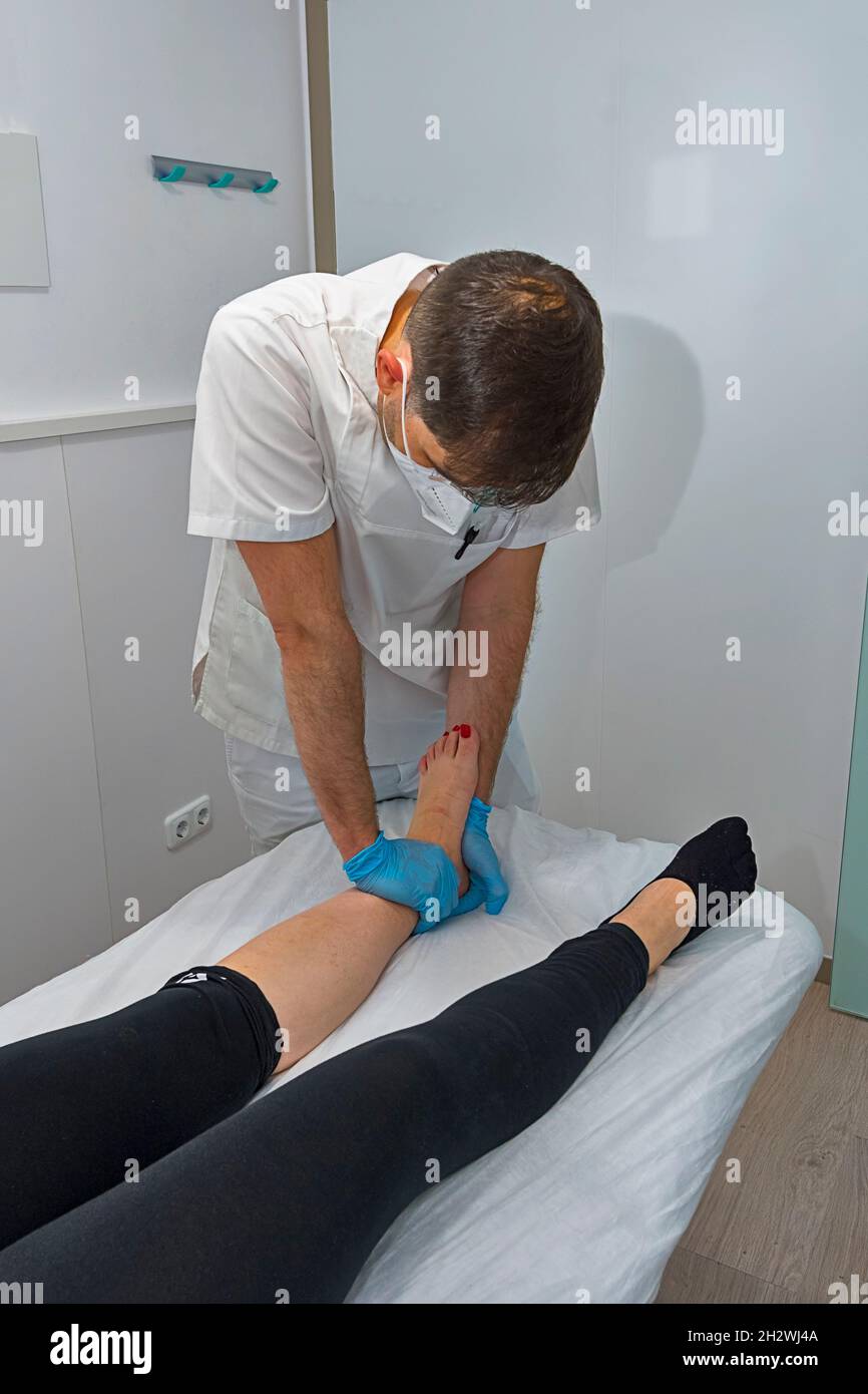 Doctor examining foot woman hi-res stock photography and images - Alamy