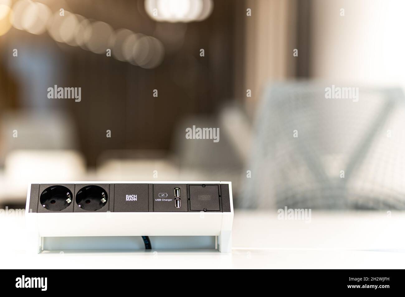 Modern extension cable connector on the desk in the office, closeup ...