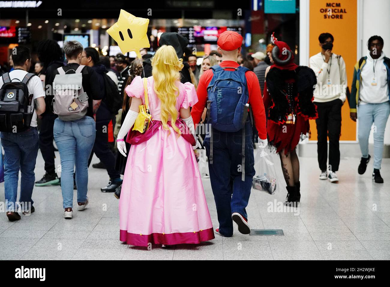 A Cosplaying couple dressed as characters from the Nintendo Super Mario ...