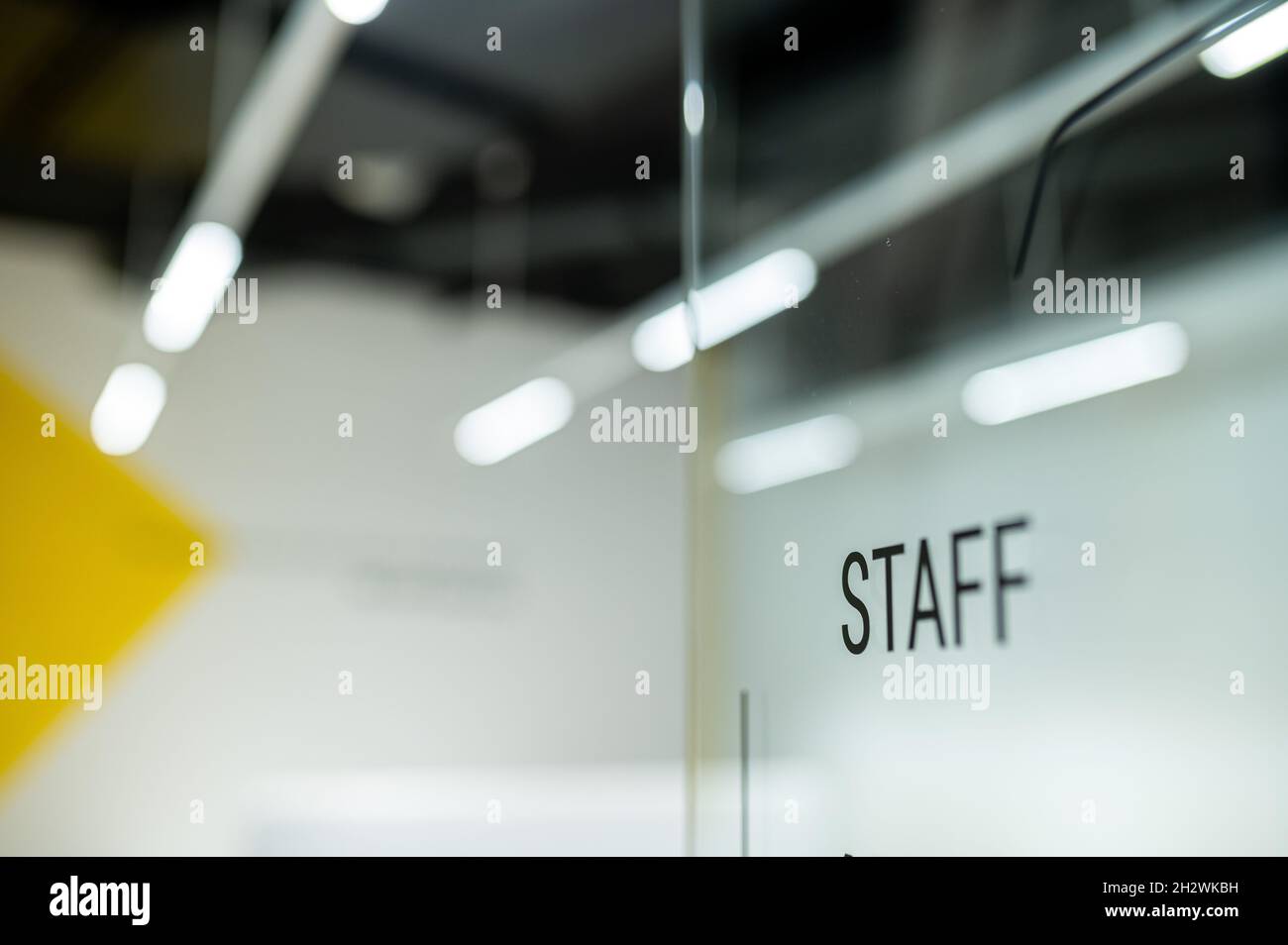 Glass door with label staff only sign room in office concept for ...