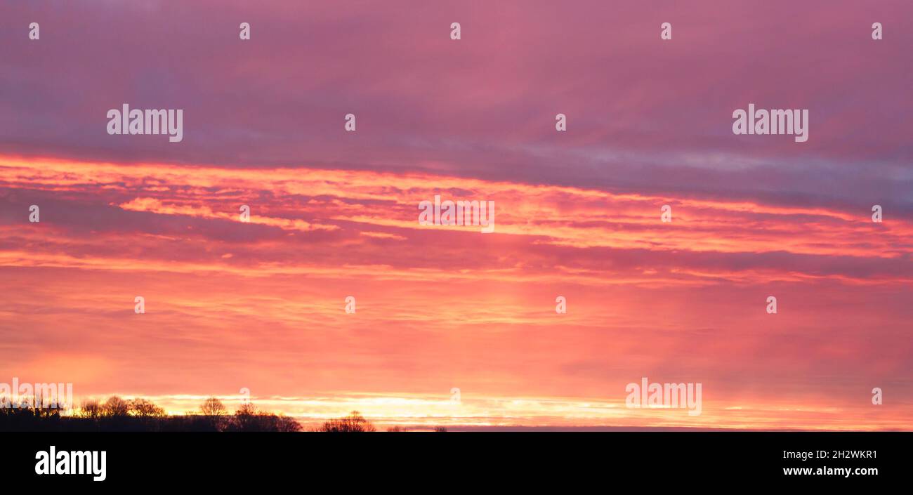 a powerful multi-coloured sky with the sunrise seemingly setting fire ...