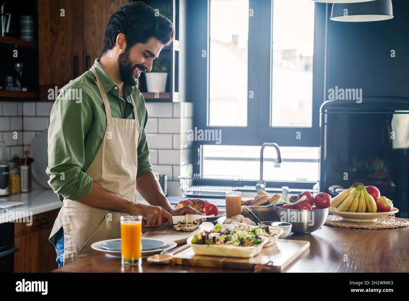 Handsome chef cooking hi-res stock photography and images - Alamy