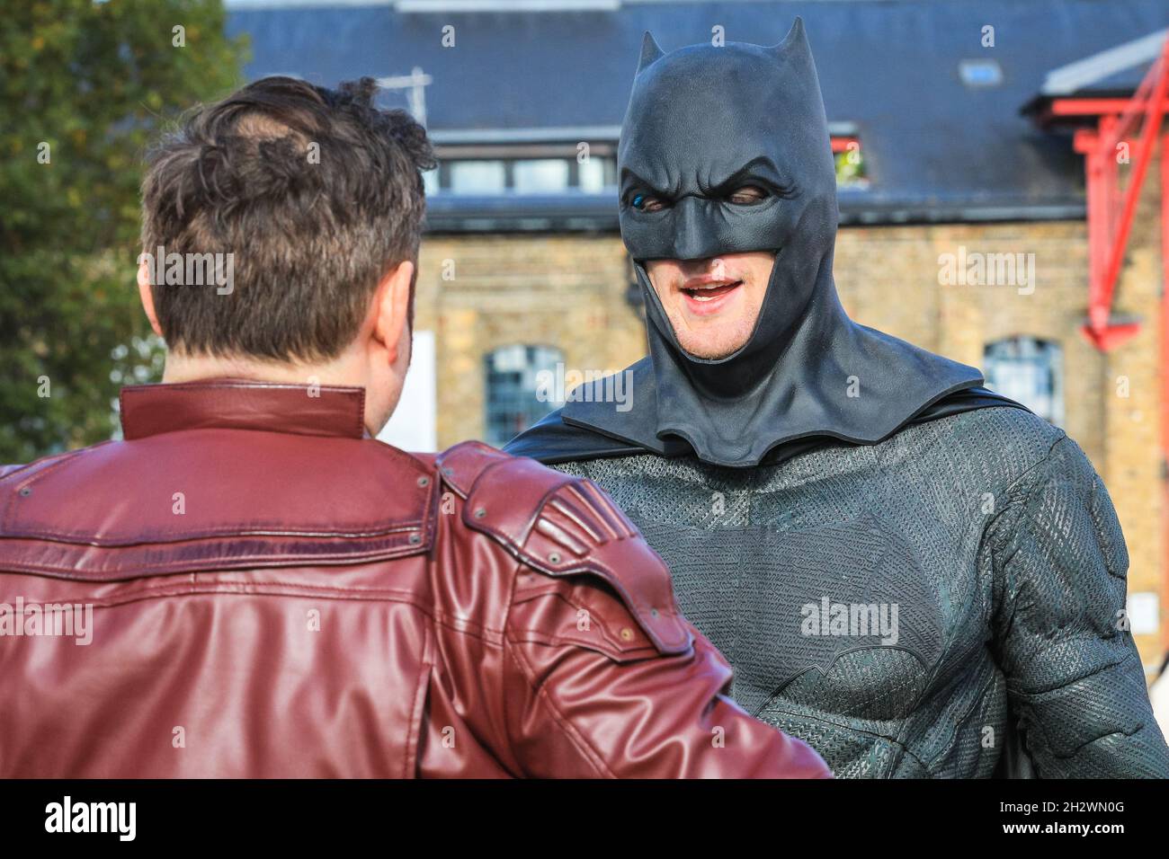 ExCel, London, UK. 24th Oct, 2021. Batman in a deep conversation ...