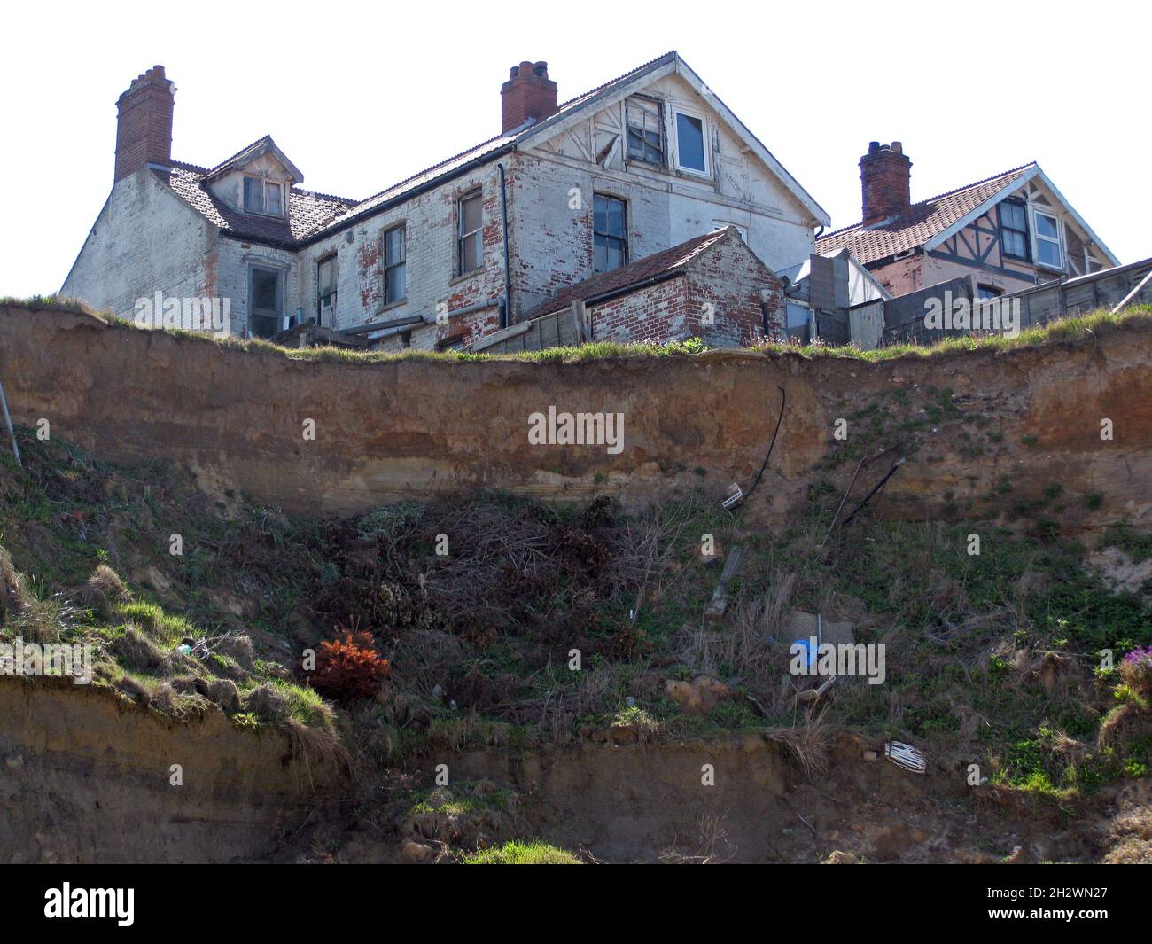 Happisburgh in Suffolk: damage to cliffs and clifftop housing due to ...
