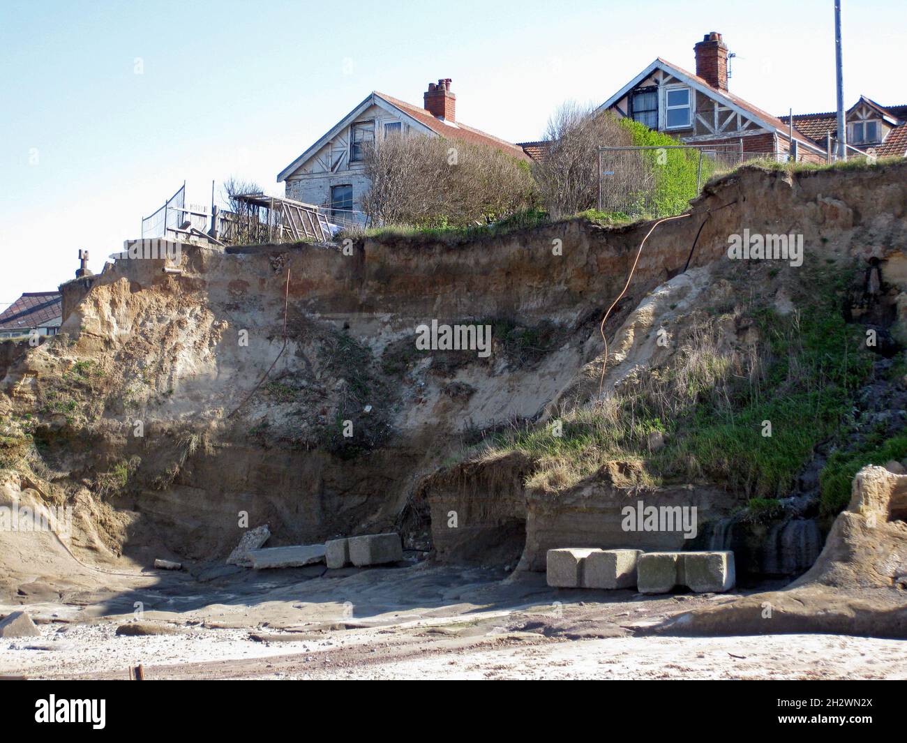 Happisburgh in Suffolk: damage to cliffs and clifftop housing due to ...