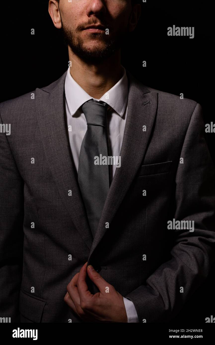 An unknown businessman wearing a smart gray suit Stock Photo - Alamy
