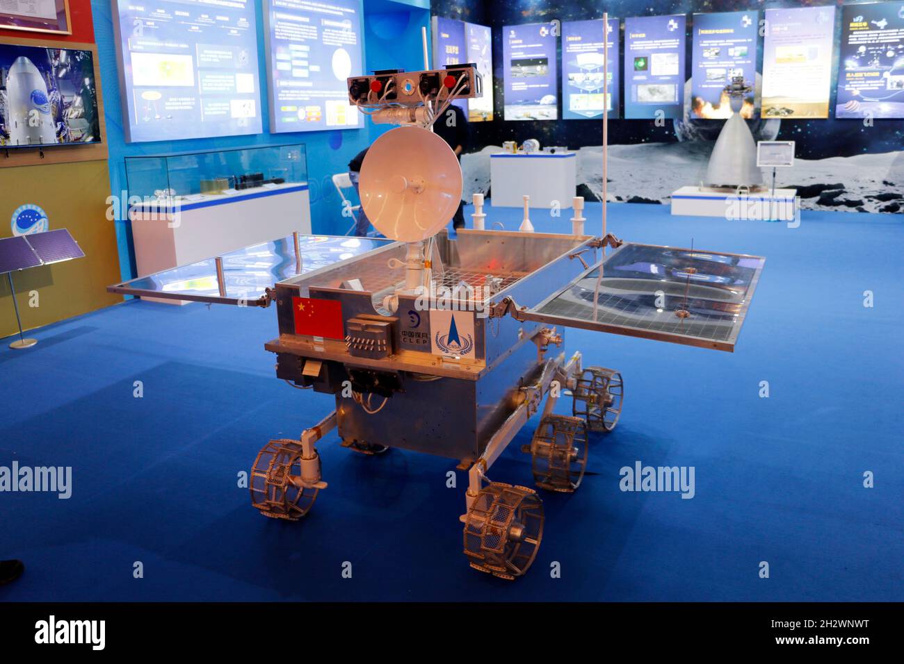 BEIJING, CHINA - OCTOBER 24, 2021 - Visitors look at a model of the ...