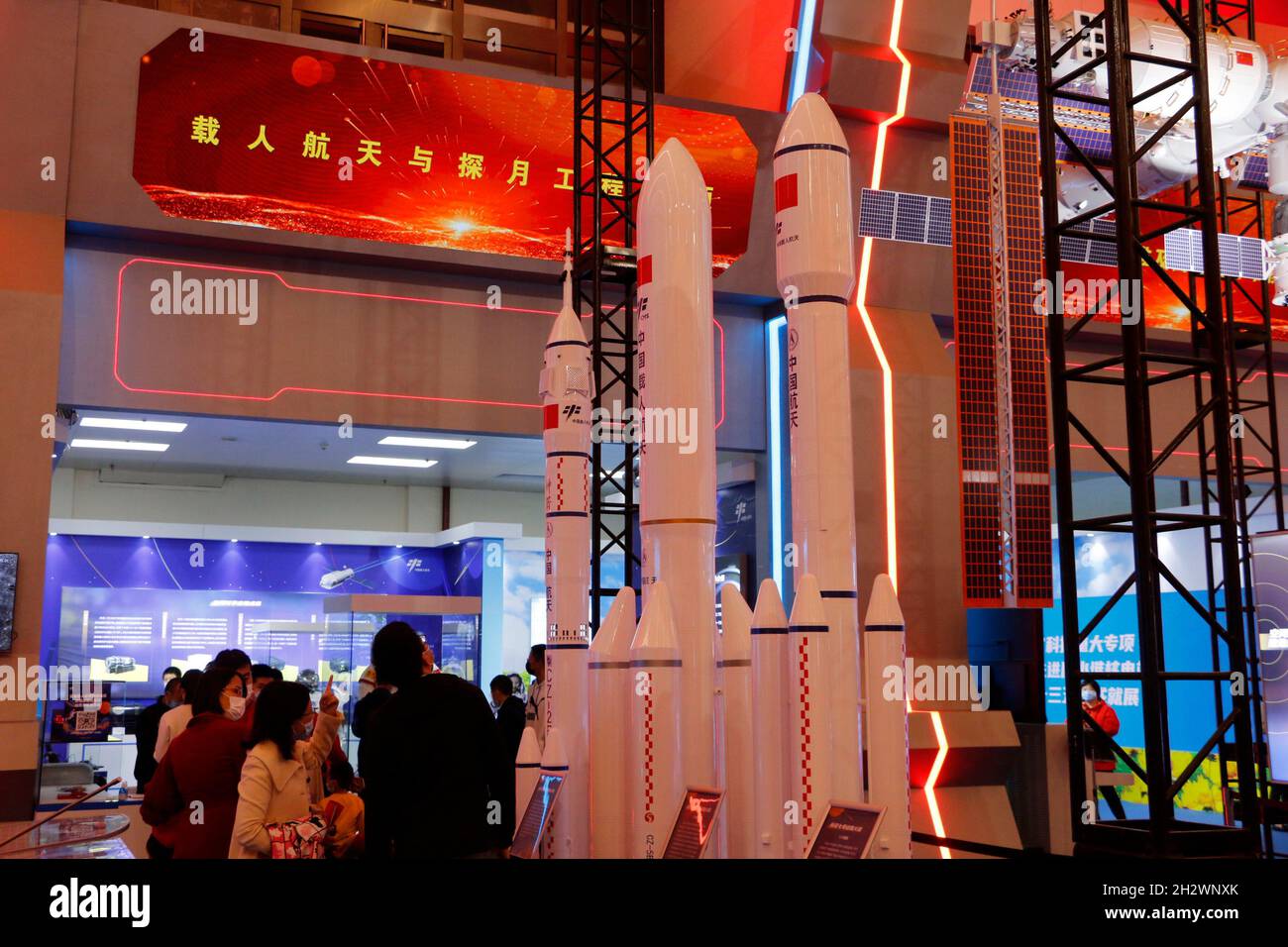 BEIJING, CHINA - OCTOBER 24, 2021 - Visitors look at models of China's ...
