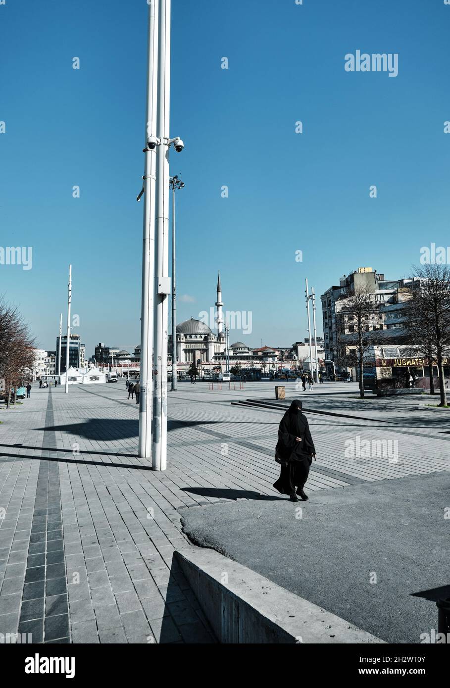 Taksim mosque and tourists walking around. Square is not crowded as ...