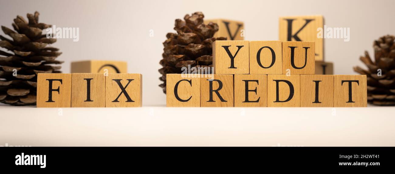 The word fix you credit was created from wooden cubes Stock Photo - Alamy