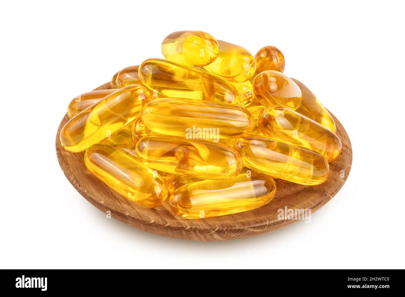 Fish oil capsules in wooden bowl isolated on white background with ...