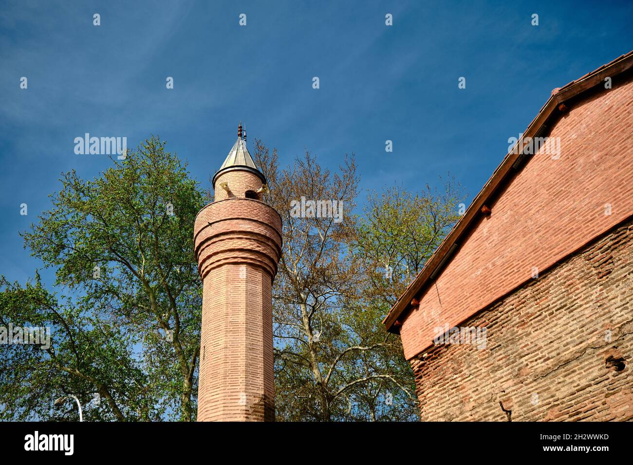 Minaret made of red bricks and tree in Bursa, Nicaea (iznik Stock Photo ...