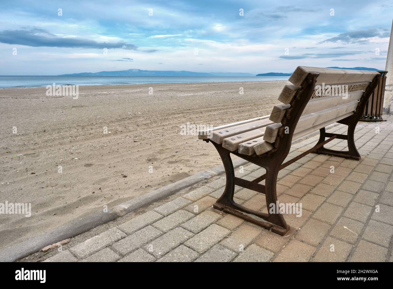 Great sea view, and beach together with wooden bench Stock Photo - Alamy