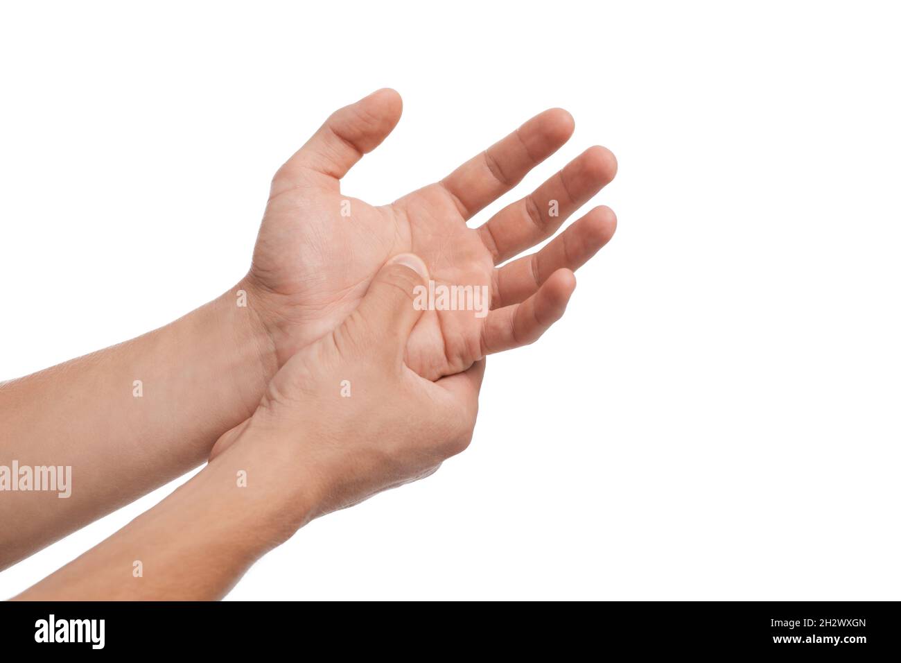 Unrecognizable millennial caucasian guy suffering from pain in arm ...