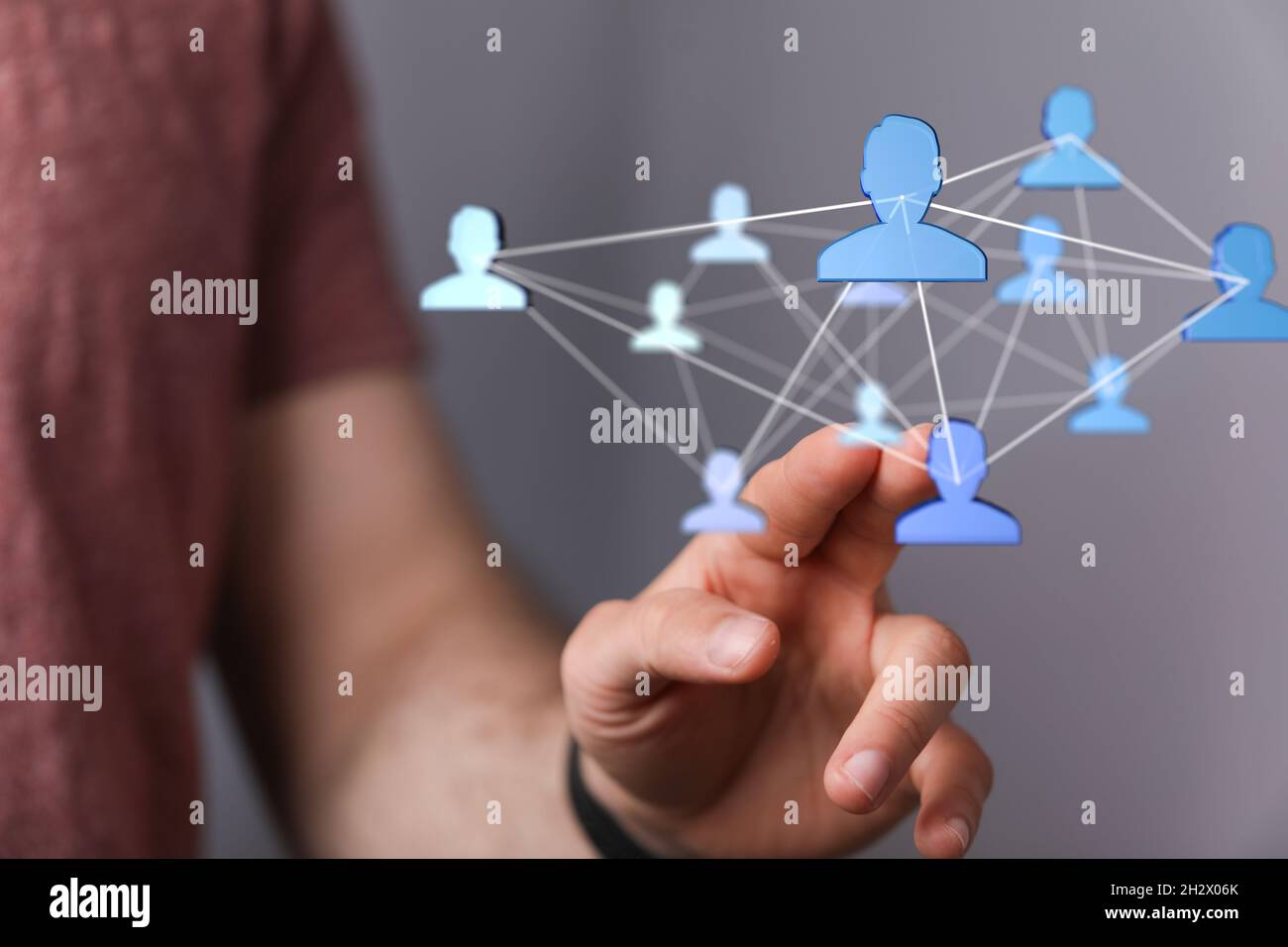 A male's hand pointing to the illustrated business cubes network team ...