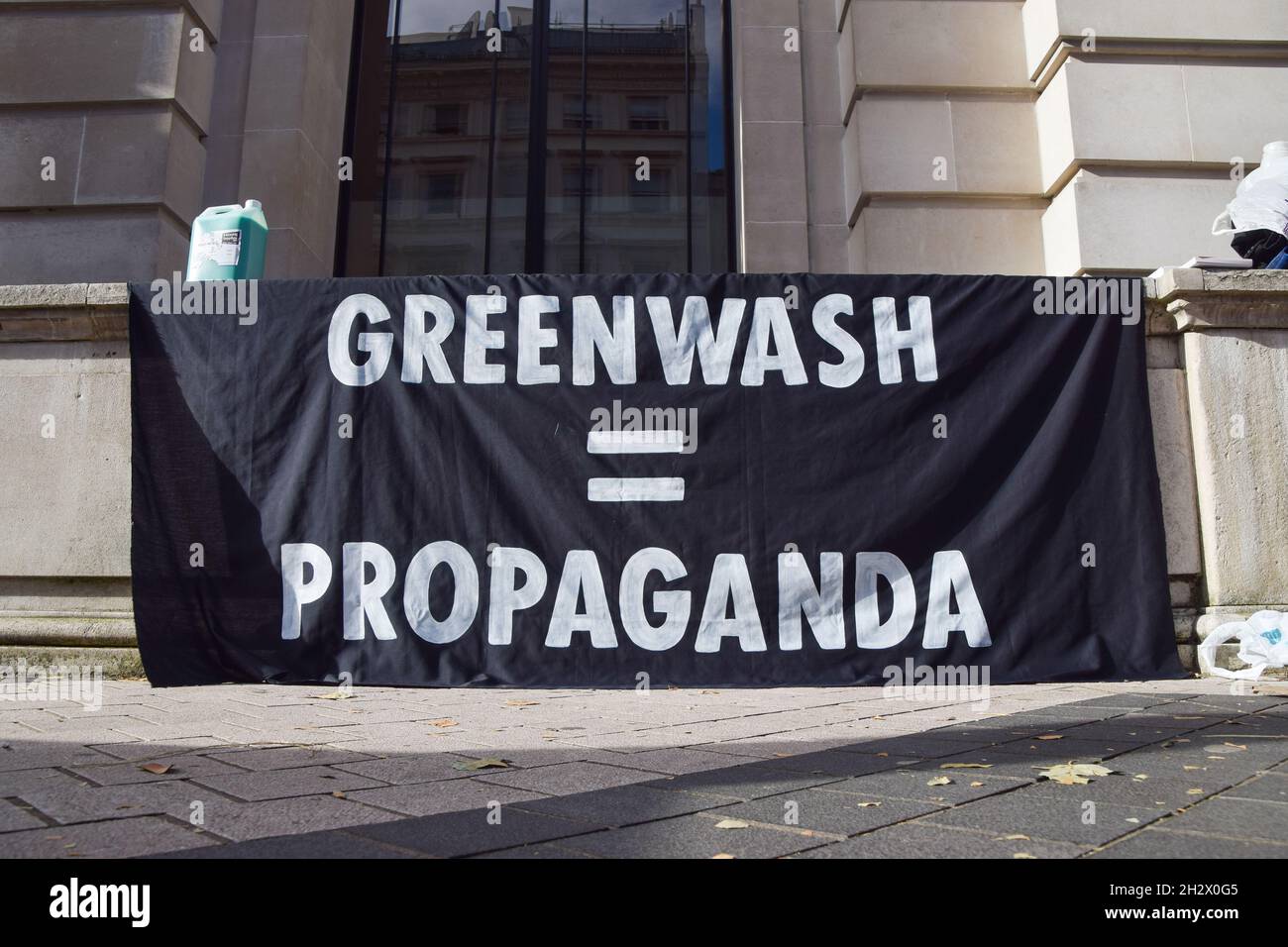'Greenwash = Propaganda' banner is seen during the protest outside the ...
