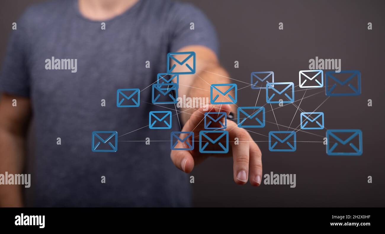 A male's hand pointing to illustrated email inboxes Stock Photo - Alamy