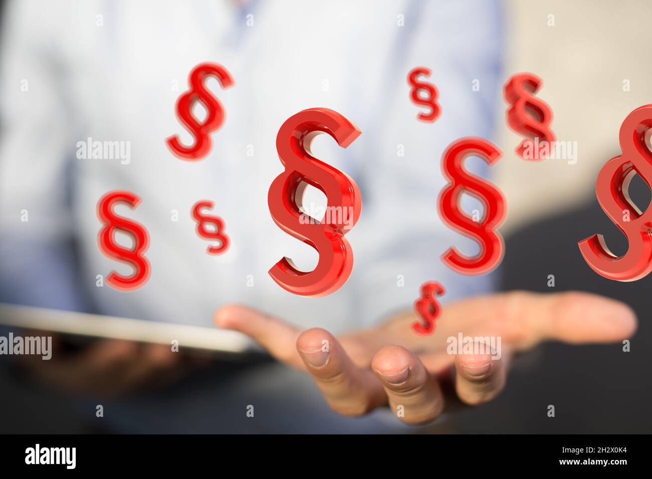 A male's hand holding illustrated law and justice symbols Stock Photo ...