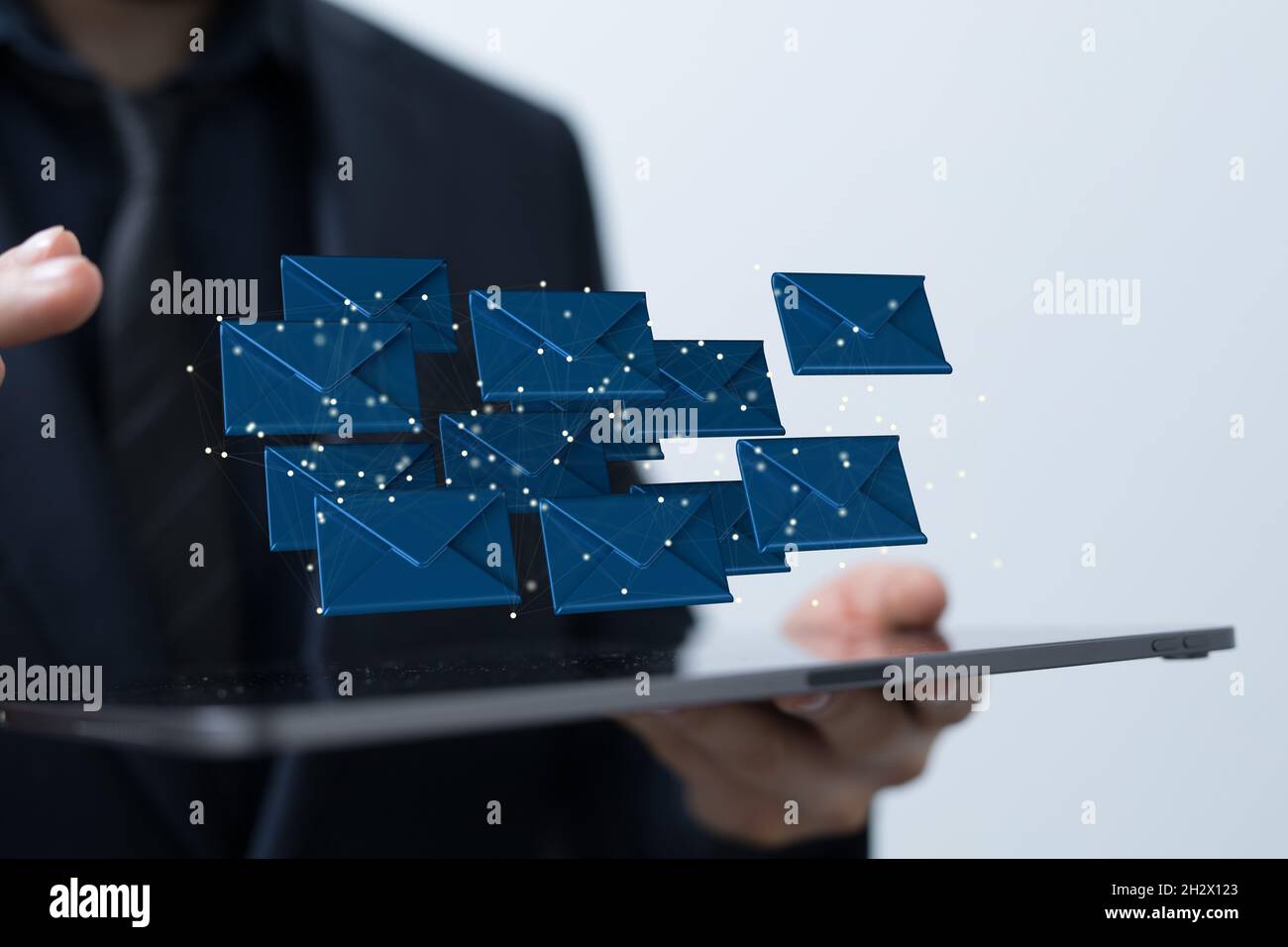 A male's hand pointing to illustrated email inbox electronic ...