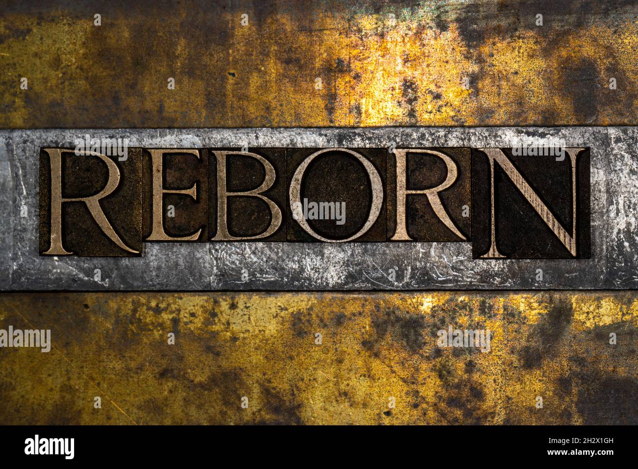 Reborn text message on textured grunge copper and vintage gold ...