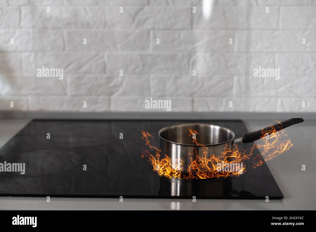 pan on the stove over a natural fire for cooking Stock Photo - Alamy