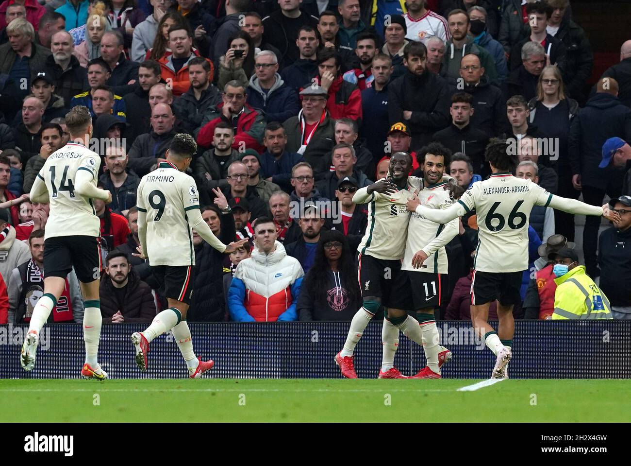 Liverpool's Mohamed Salah (second right) celebrates scoring their side ...