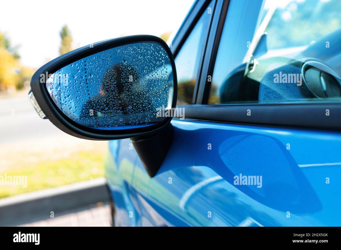 raindrops on the wet side-view mirror. rainy weather and car wash Stock ...