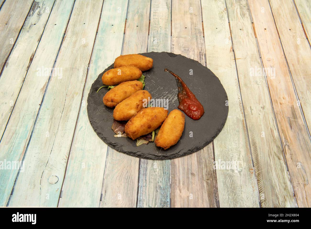 delicious homemade chicken croquettes with tomato jam served as tapas ...