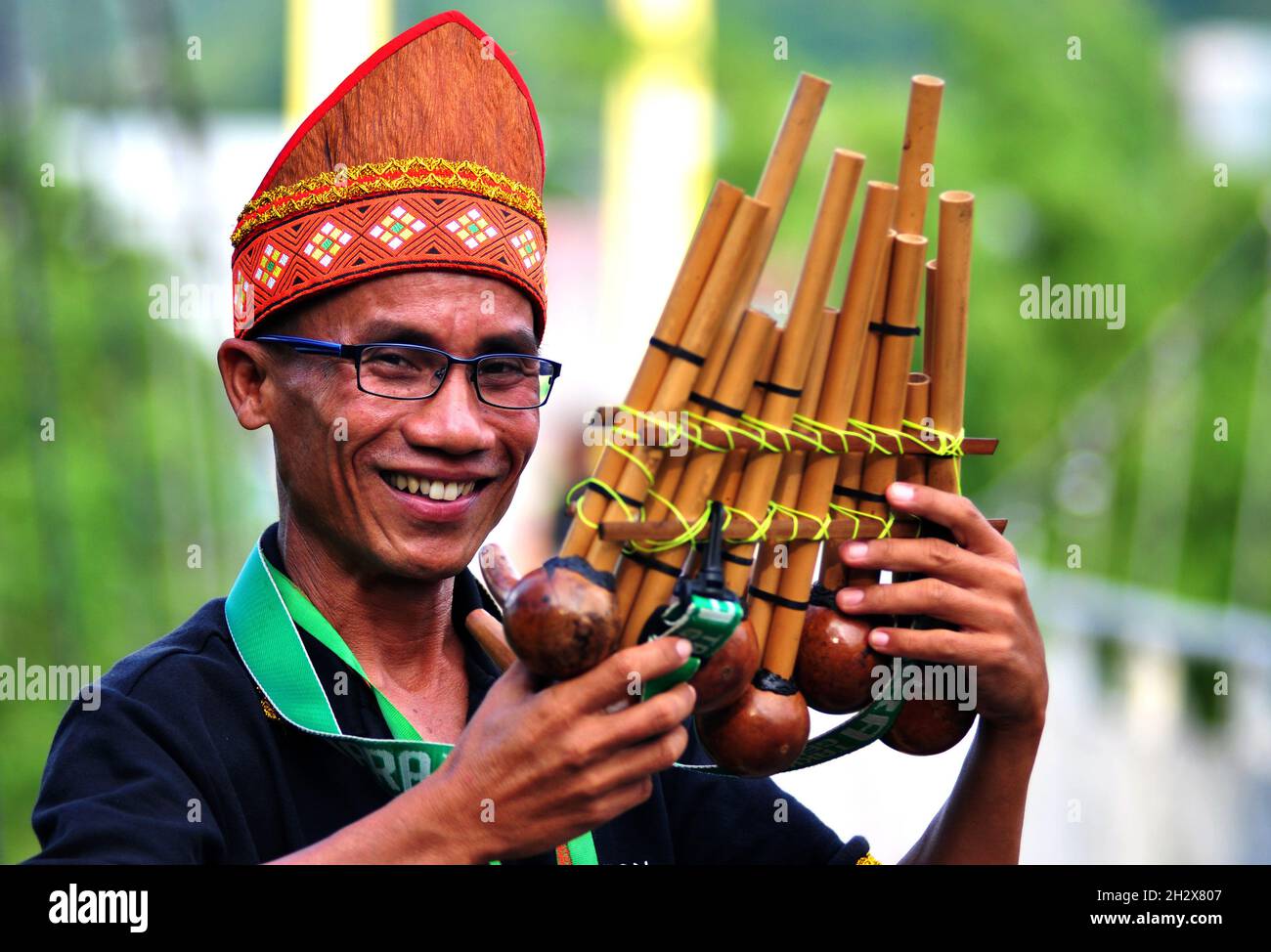 Dusun ethnic men from the interior of Kiulu, Sabah, Malaysia, show a ...