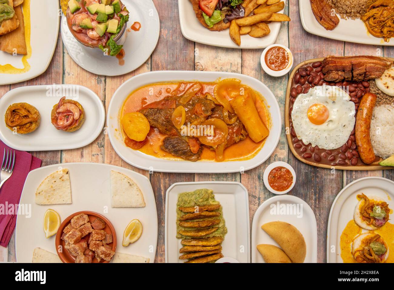 Top view image of a set of Colombian food dishes, with valluna cutlet ...