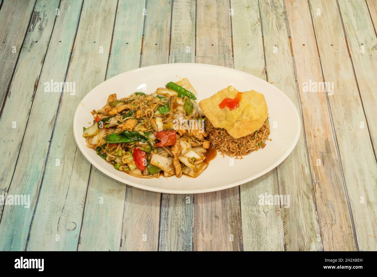 Combination plate of chicken with noodles and vegetables, chaufa rice ...