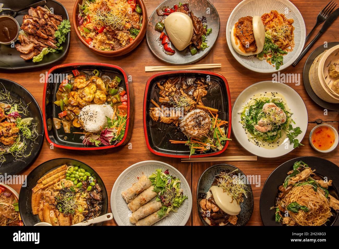 Set of Asian dishes, bao bread, noodles, prawns, shrimp, ramen with ...