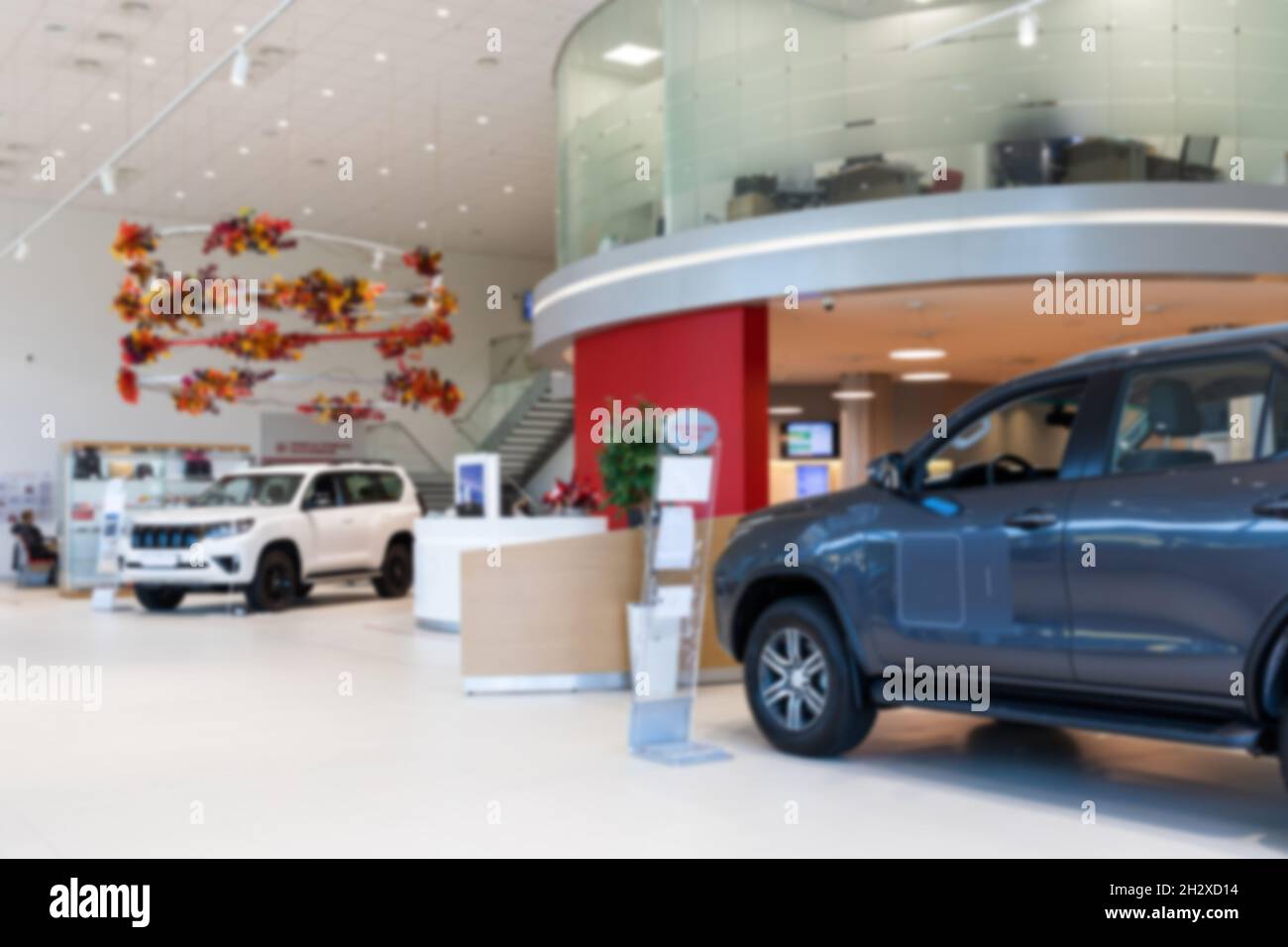 interior of a car dealership selling premium cars, photo with blur ...