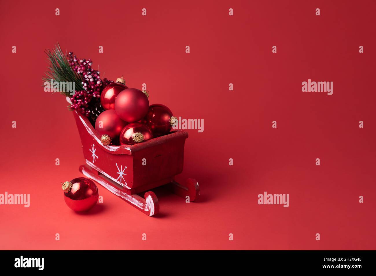 Christmas concept, Red Santa's Sleigh with baubles on a red background ...