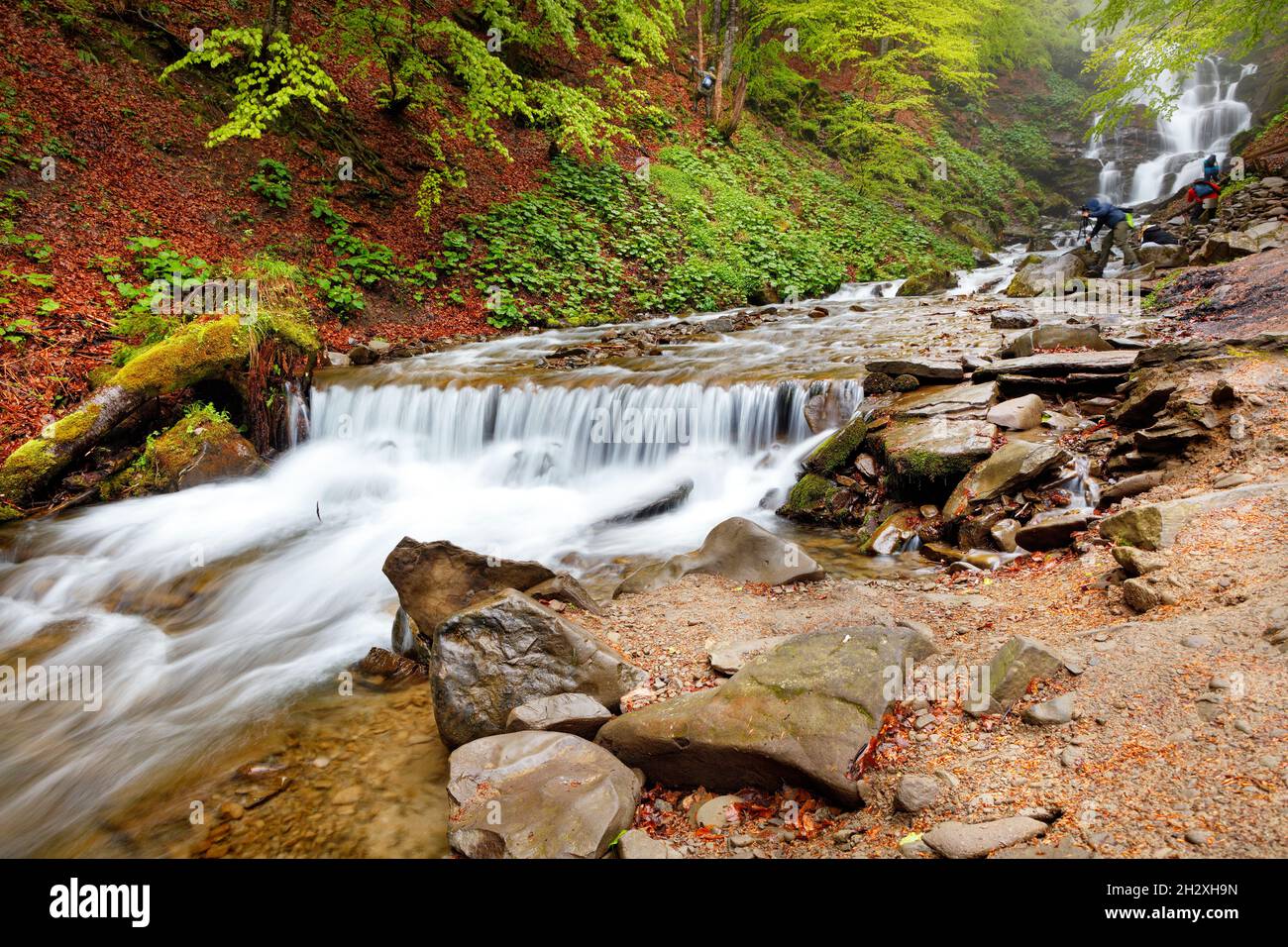 The mountain river in the springtime brings coolness and freshness ...