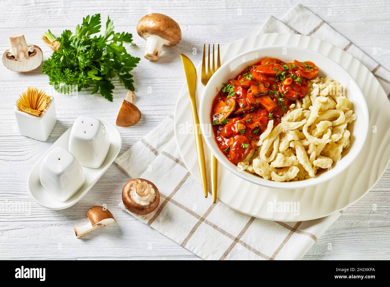 spaetzle with mushroom gravy in a white bowl, jagerspatzle ...