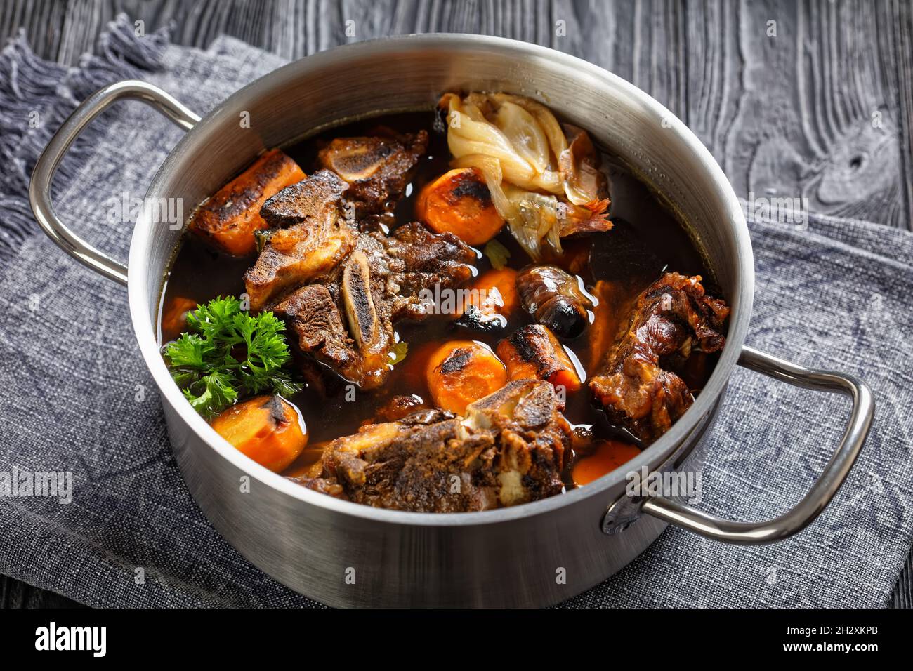 beef broth of beef meat on bones slow cooked with charred vegetables ...