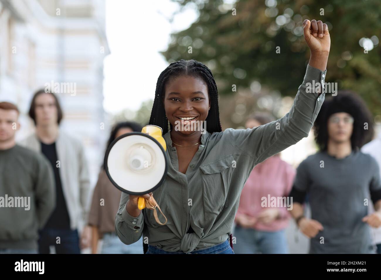 Charismatic black lady activist with megaphone on the street Stock ...