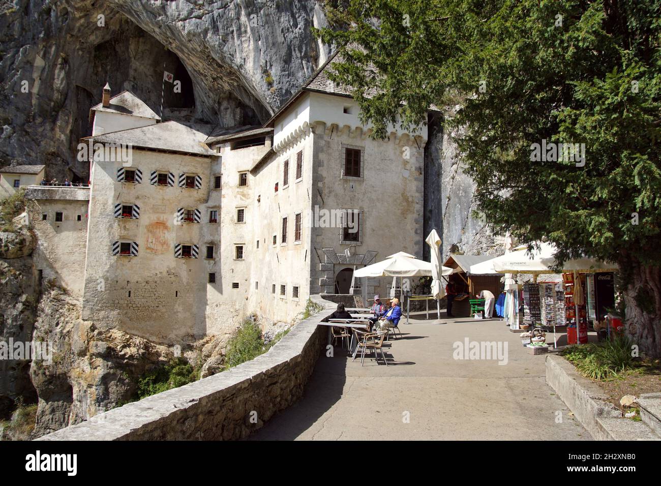 Terrace, entrance to cave castle Predjama Castle near Postojna. 800 ...