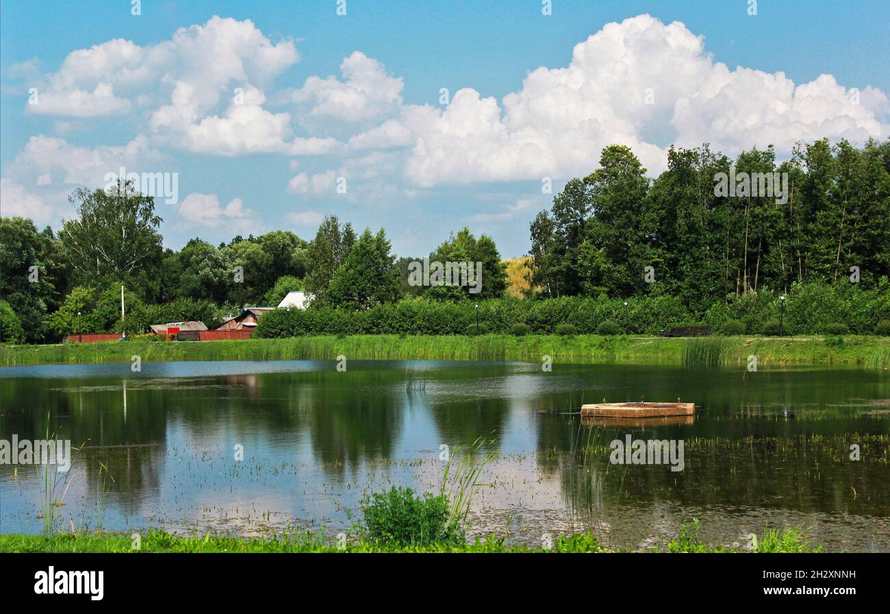 View of the Belarusian village on the lake in the summer heat Stock ...