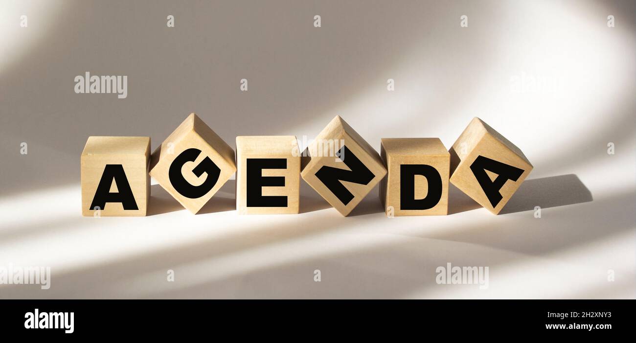 Agenda - words from wooden blocks with letters, a list of matters ...