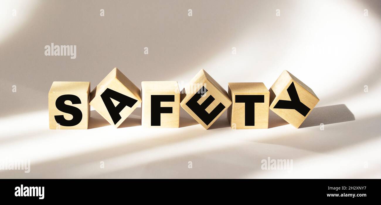 safety word written on wood block. safety text on wooden table for your ...
