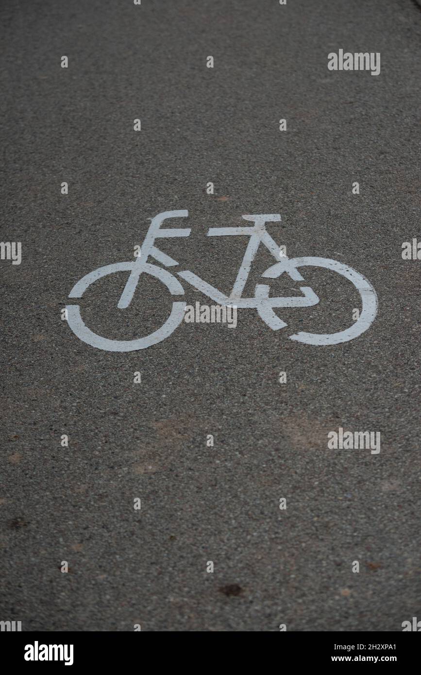 Bicycle path logo symbol on gray asphalt. close-up Stock Photo - Alamy