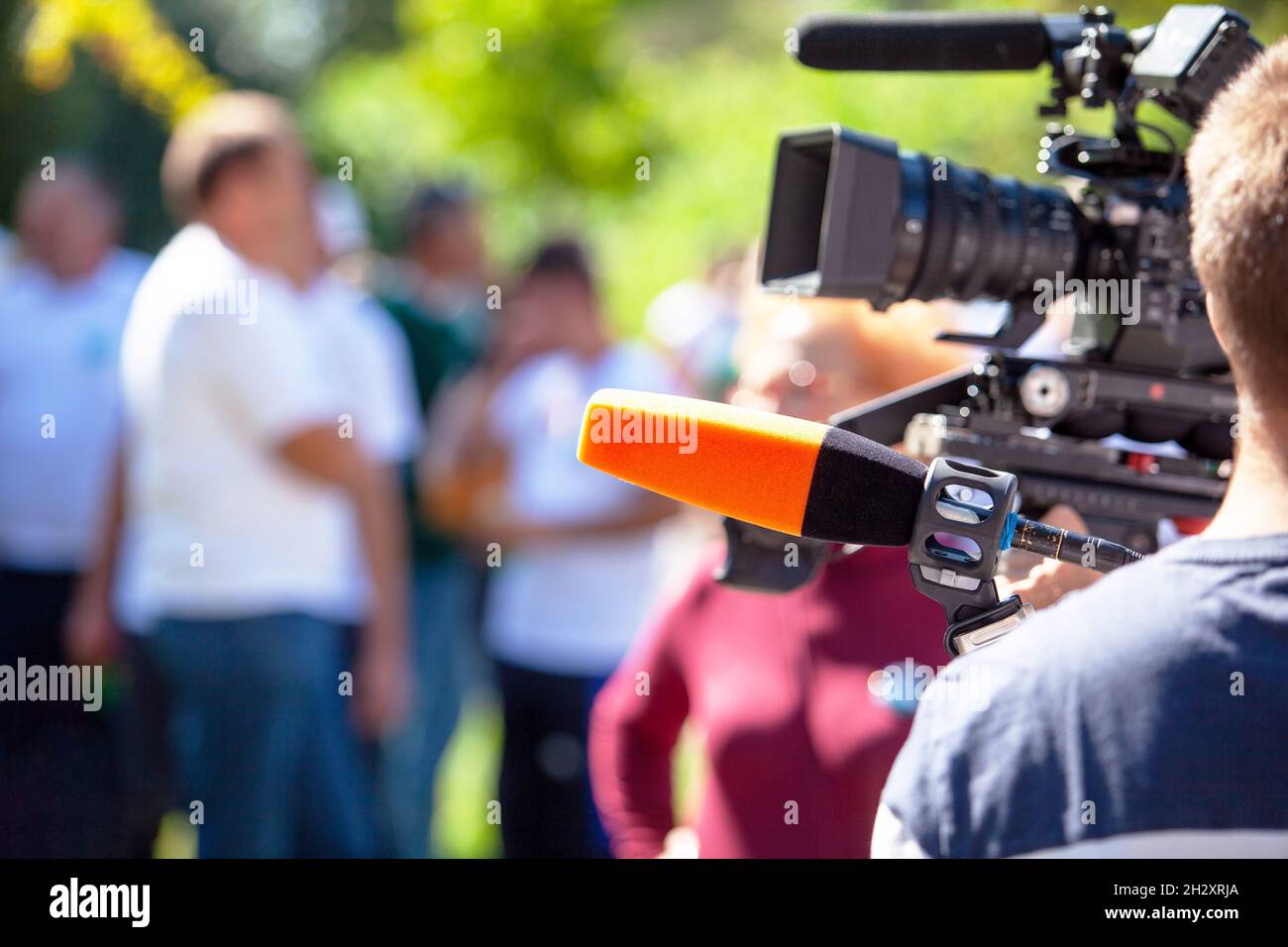 Filming media event or news conference with a video camera Stock Photo ...