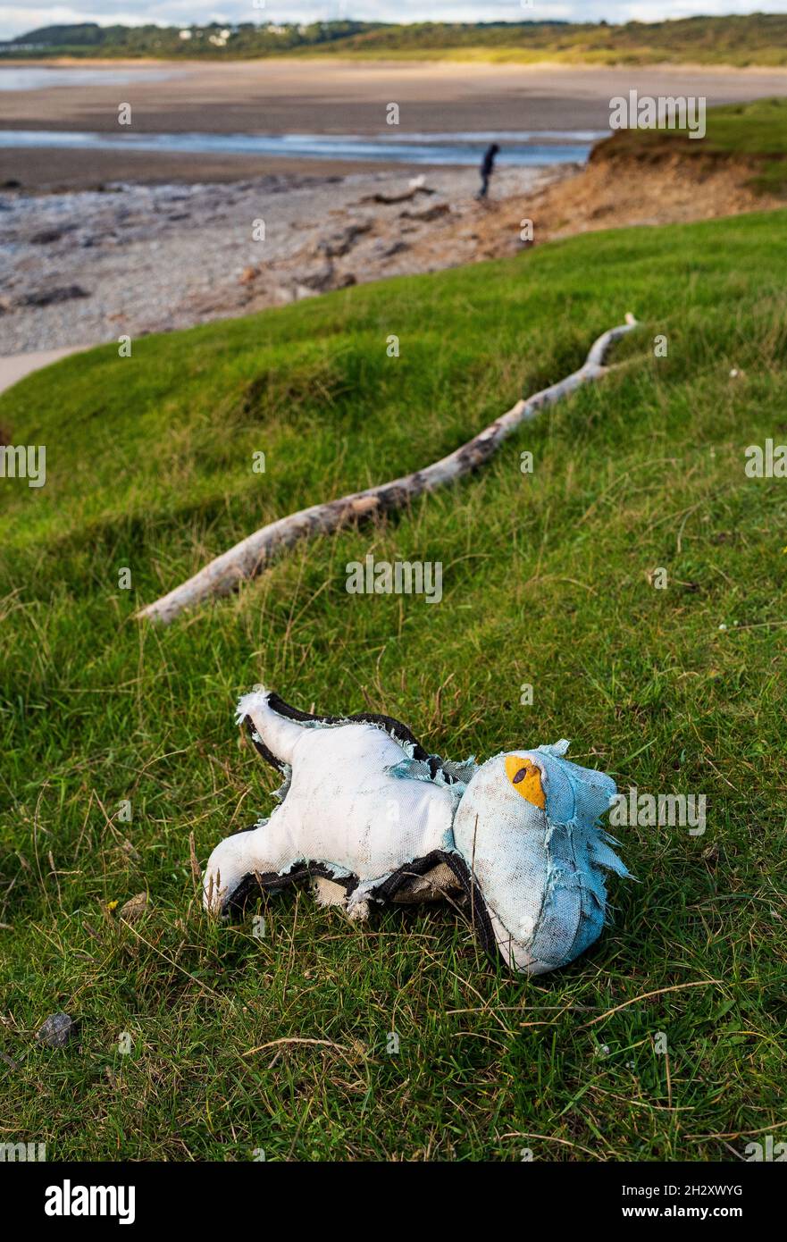 Discarded child's toy on beach Stock Photo - Alamy