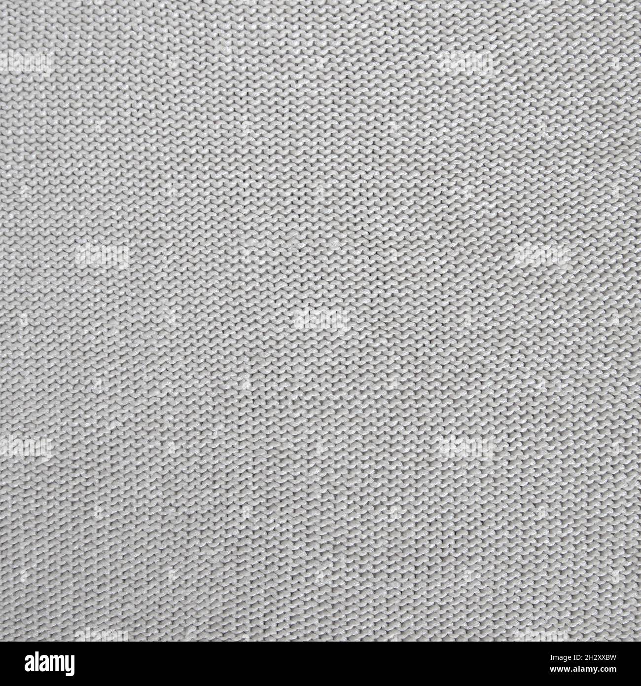 Real grey knitted fabric made of heathered yarn textured background ...