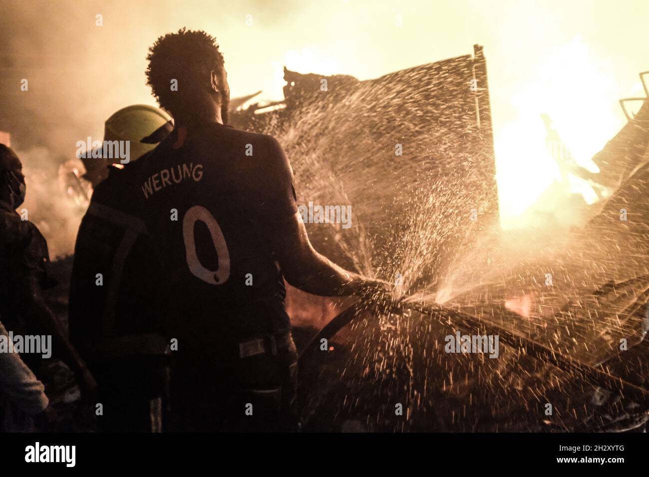 Nairobi, Kenya. 23rd Oct, 2021. Homeless residents and firefighters ...