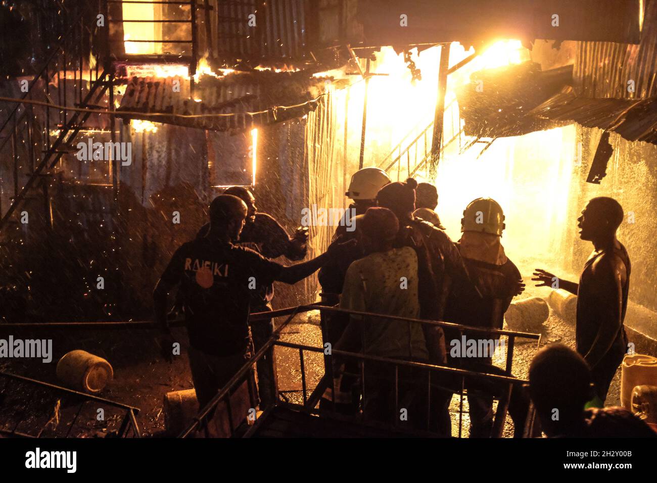 Nairobi, Kenya. 23rd Oct, 2021. Homeless residents and firefighters ...