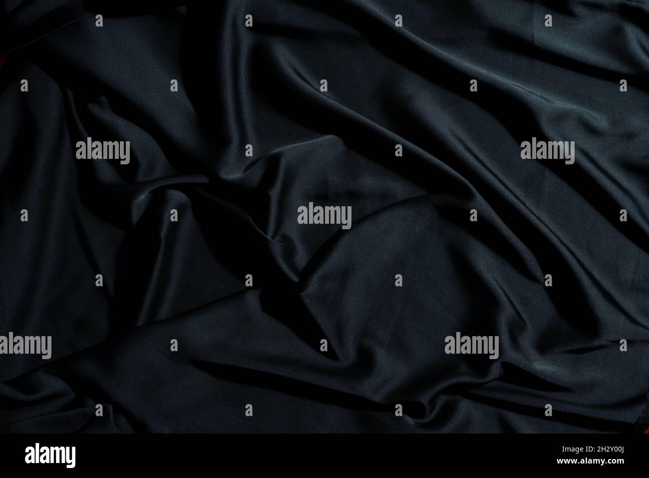Crumpled textile fabric background of black color Stock Photo - Alamy
